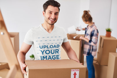 Placeit - V-Neck T-Shirt Mockup of a Man Packing for a Move