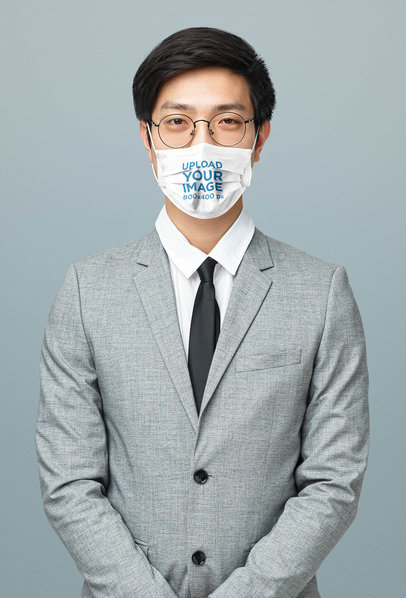 Placeit - Studio Mockup of a Man in a Suit Wearing a Face Mask