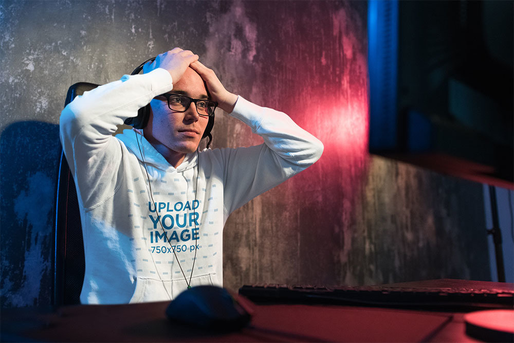 Placeit - Hoodie Mockup Featuring a Worried Gamer