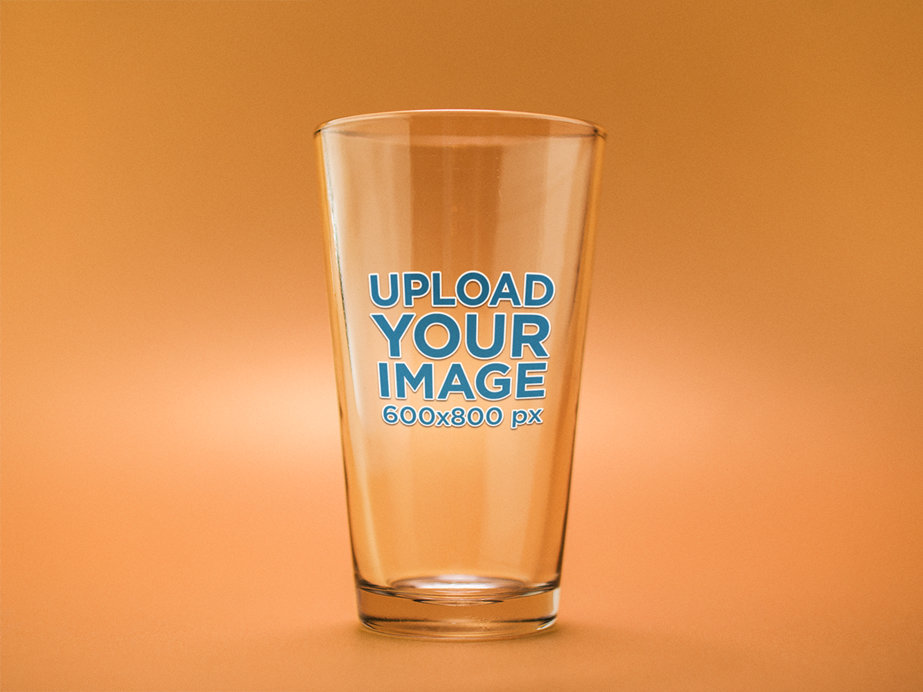 Placeit - Template of an Empty Pint Glass Against an Orange Background