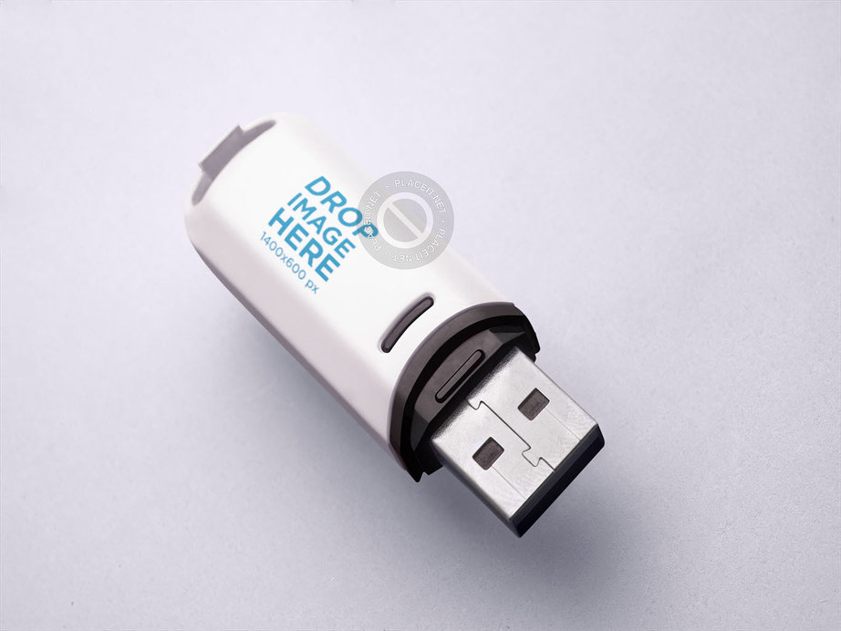 Placeit - Template of a USB Flash Drive Lying on a White Surface