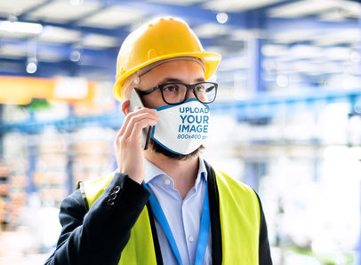 Placeit - Face Mask Mockup Featuring a Civil Engineer Making a Call