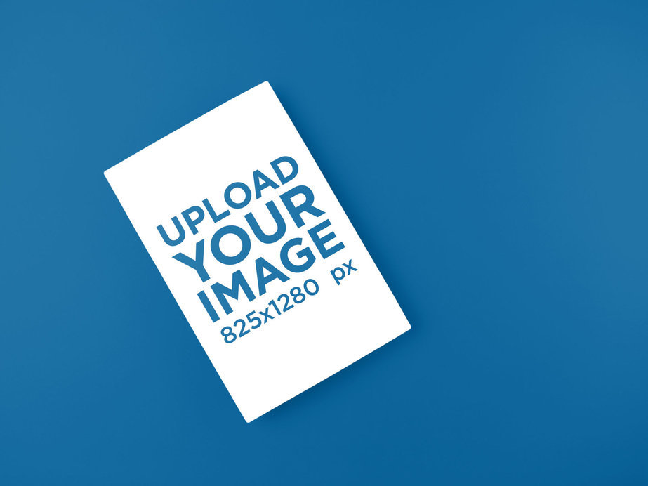 Placeit - Mockup of a Flyer Lying on a Solid Surface