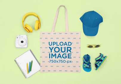 Placeit - Mockup of a Tote Bag with Kid's Items for a Summer Trip