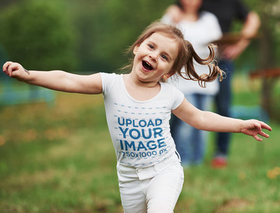 Placeit - T-Shirt Mockup of a Happy Girl Singing While Walking