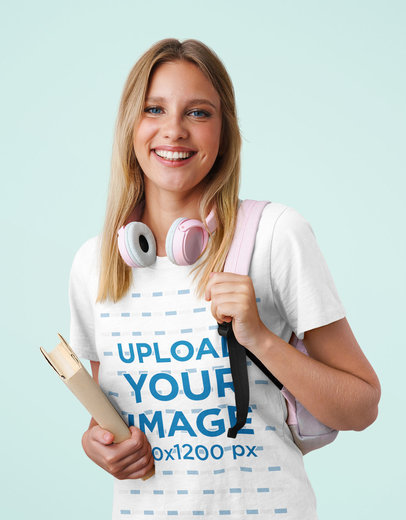 Placeit - Basic T-Shirt Mockup of a Young Female Student at a Studio