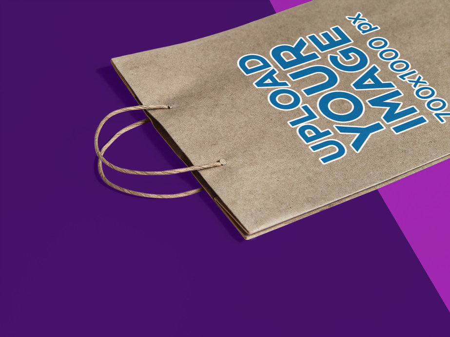 placeit-angled-mockup-of-a-paper-bag-lying-on-a-bicolor-surface