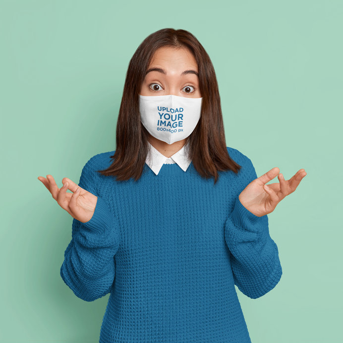 Placeit - Face Mask Mockup Featuring a Confused Woman in a Studio