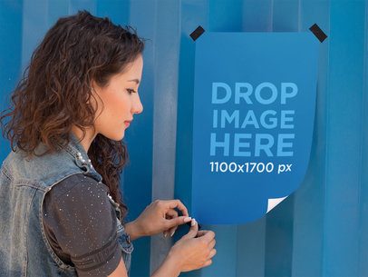 Placeit - Mockup Template of a Woman Taping a Poster to a Wall