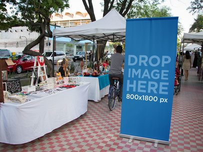 Placeit - Vertical Banner Mockup in a Street Flea Market